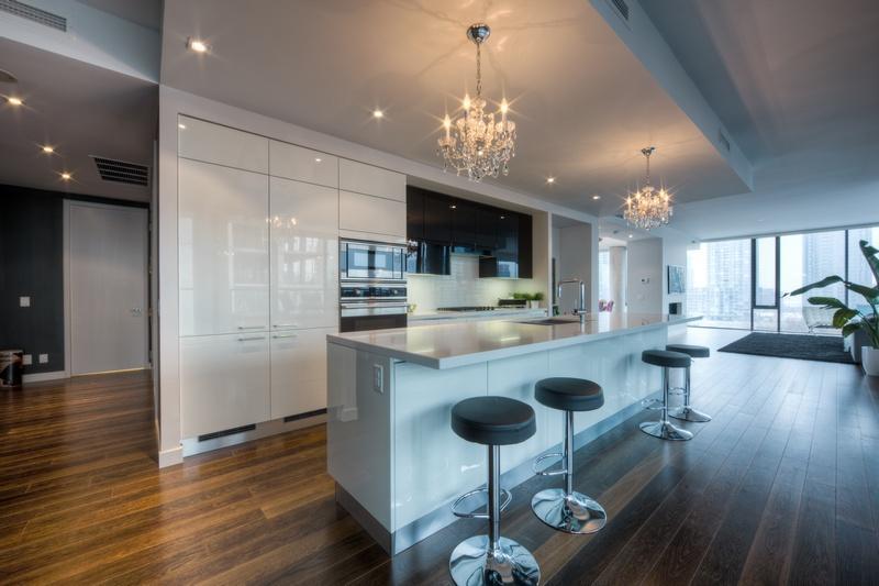 kitchen down lit featuring classic twin chandelier breakfast bar ...