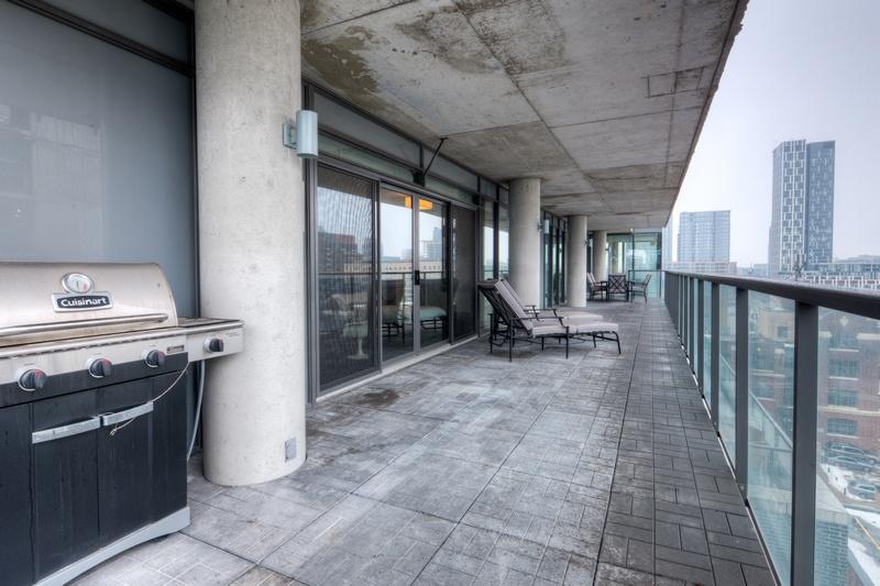 terrace with barbeque deckchairs and city view | Interior Design Ideas