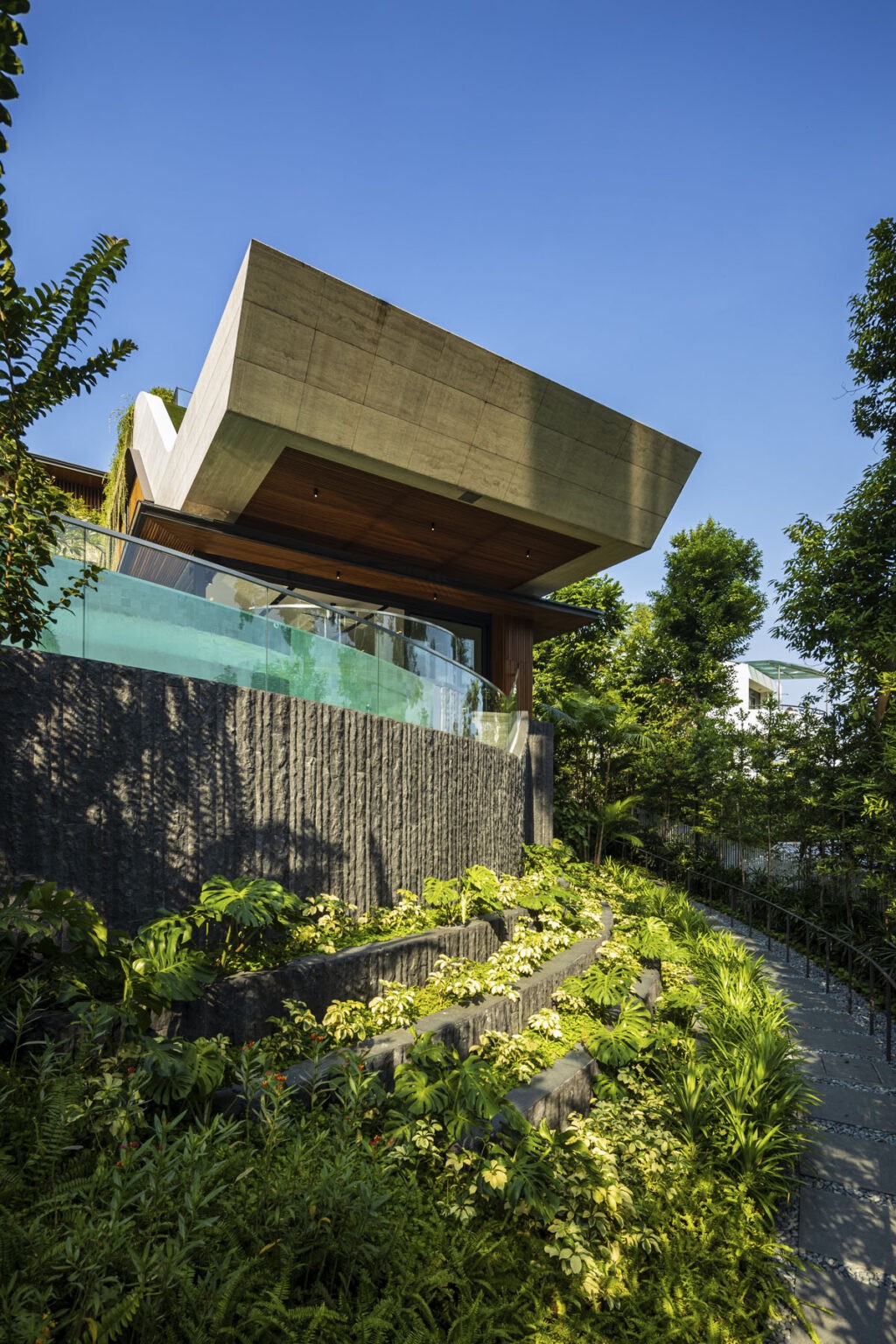 Curvilinear Home Design With Green Roofs & A Water Garden